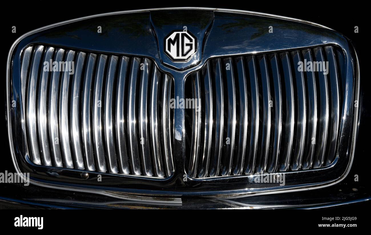 The front grille of a vintage MG sports car on display at a car show in ...