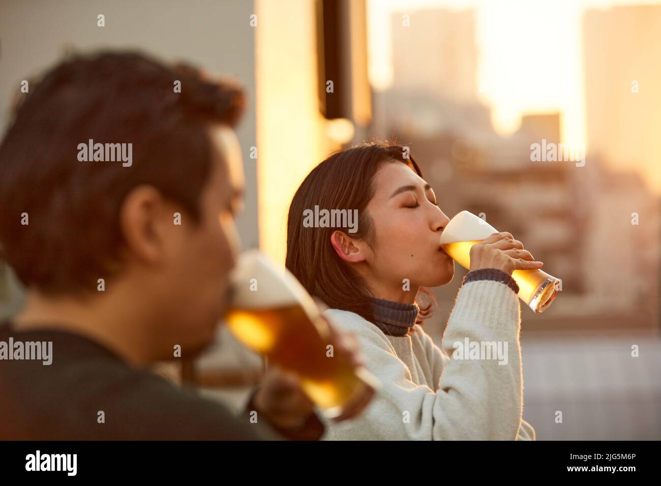 Japanese people having a drink outside Stock Photo - Alamy