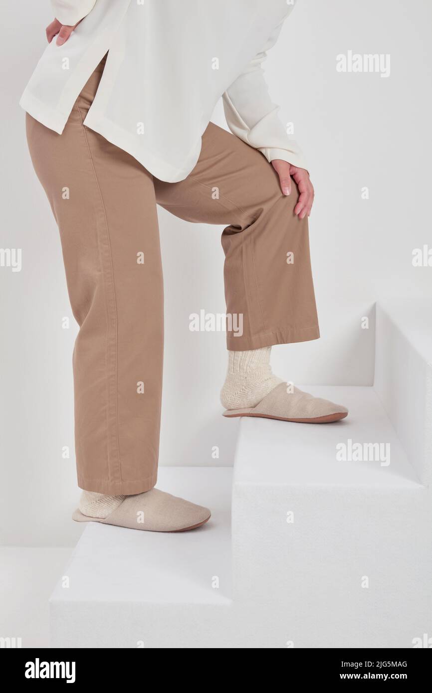 Japanese woman climbing stairs Stock Photo - Alamy