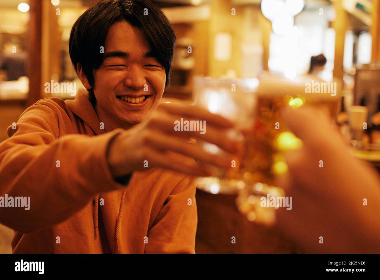 Japanese man having a drink Stock Photo - Alamy