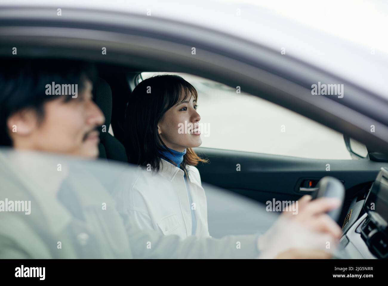 Japanese couple having a drive together Stock Photo - Alamy