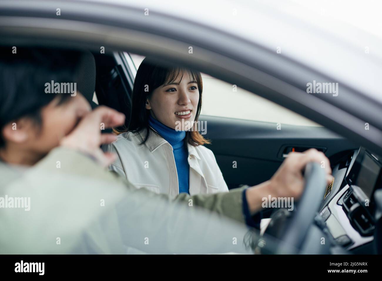 Japanese couple having a drive together Stock Photo - Alamy