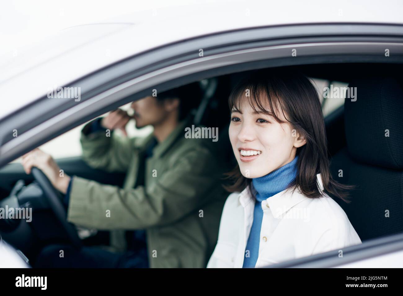 Japanese couple having a drive together Stock Photo - Alamy