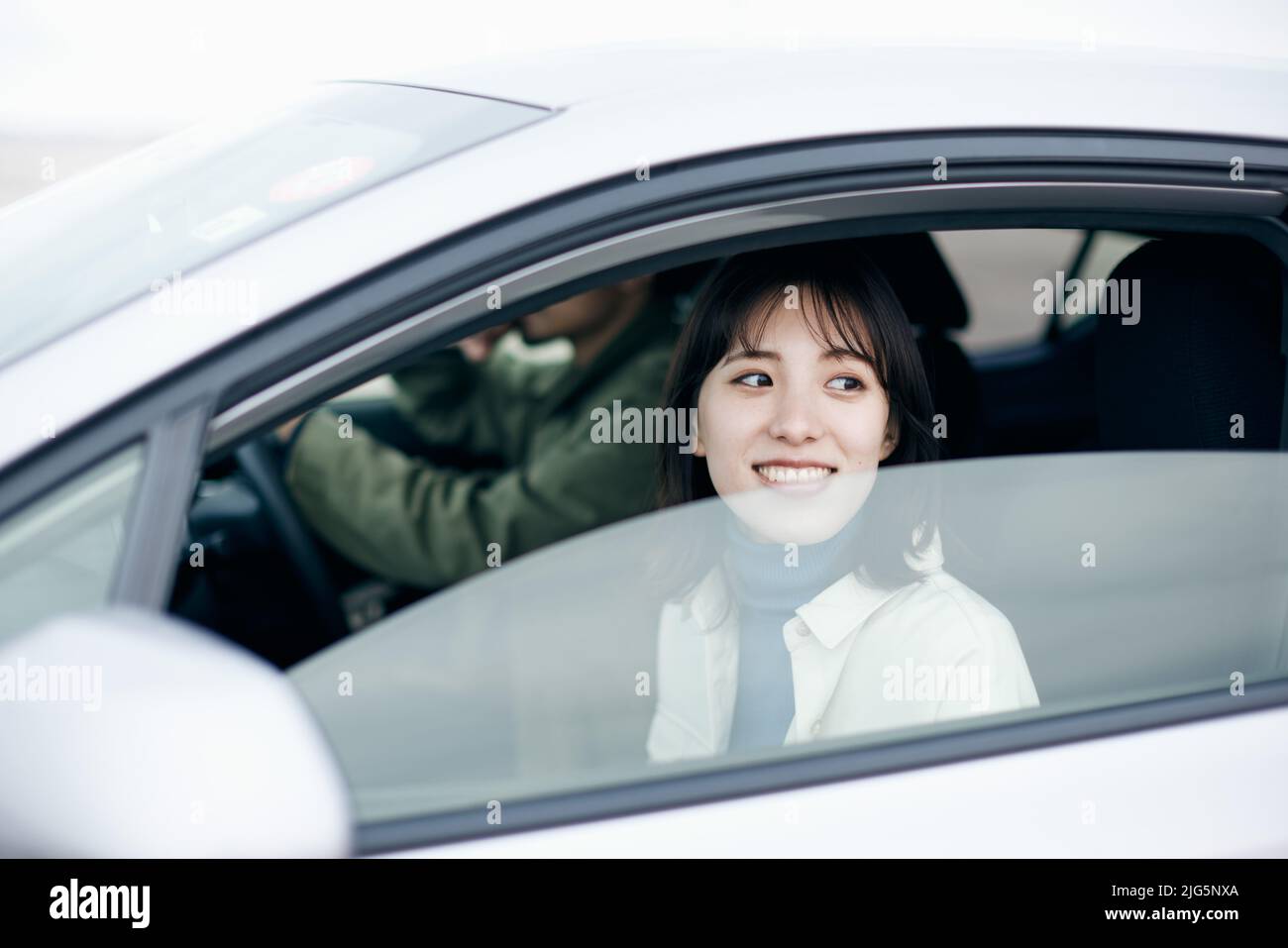 Japanese couple having a drive together Stock Photo - Alamy