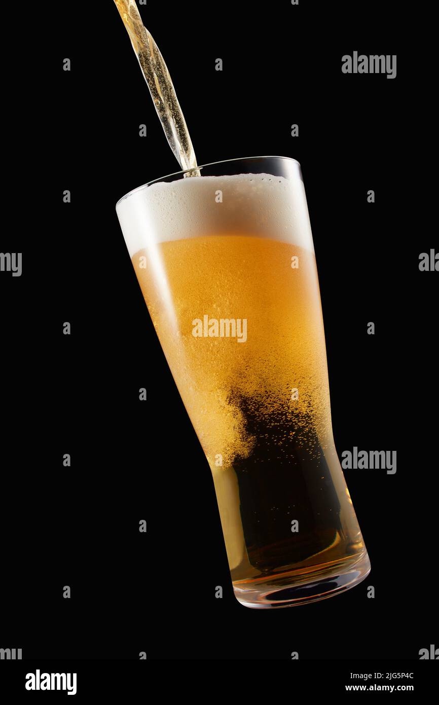 Beer on black background Stock Photo - Alamy