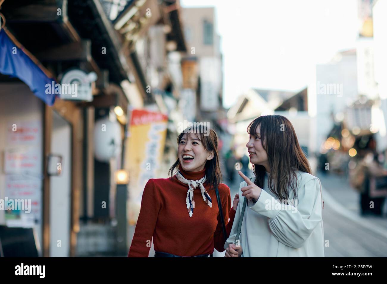 Young Japanese women enjoying a trip together Stock Photo - Alamy