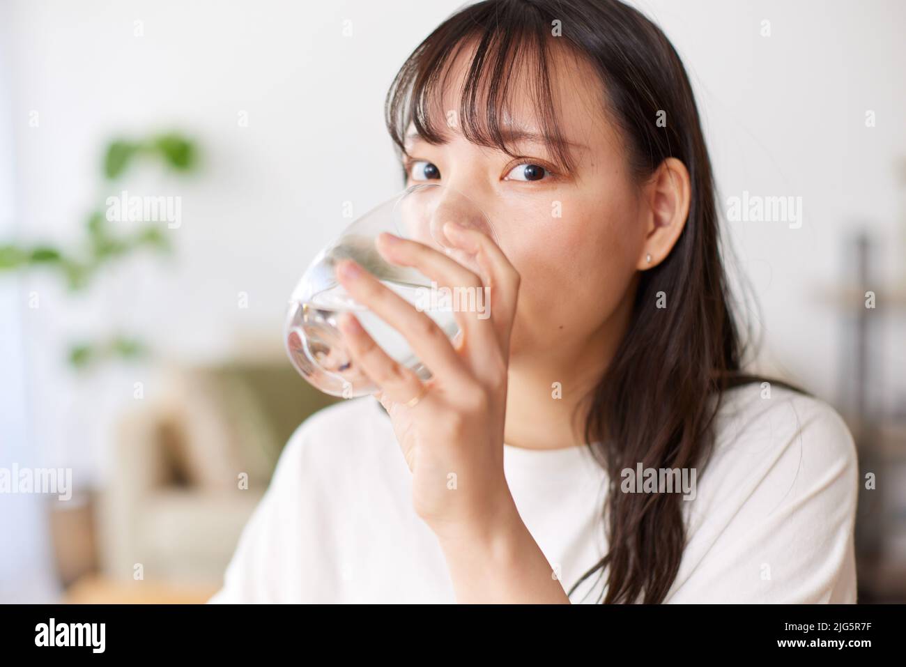 Japanese woman drinking water Stock Photo - Alamy