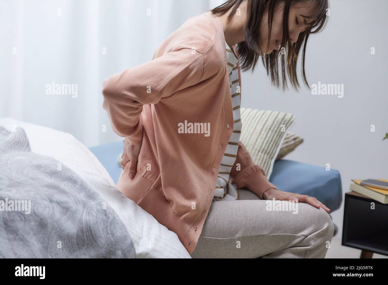 Japanese woman sick in bed Stock Photo - Alamy