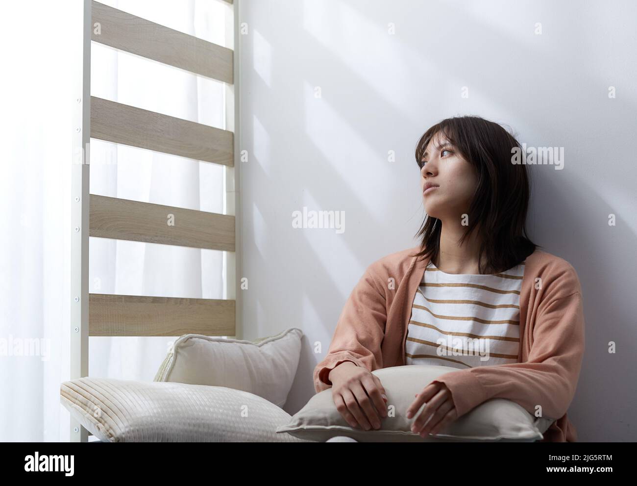 Japanese woman depressed in bed Stock Photo - Alamy