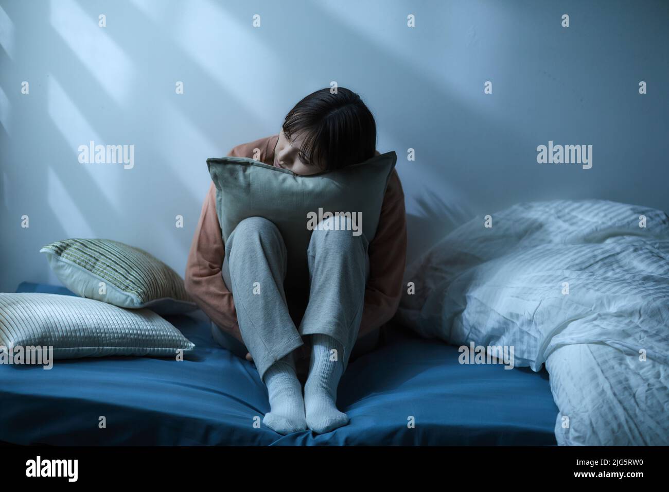 Japanese woman depressed in bed Stock Photo - Alamy