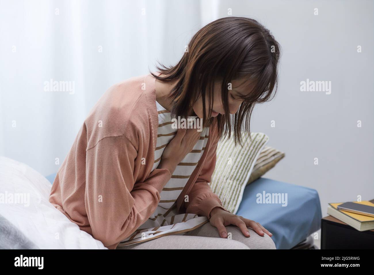 Japanese woman sick in bed Stock Photo - Alamy