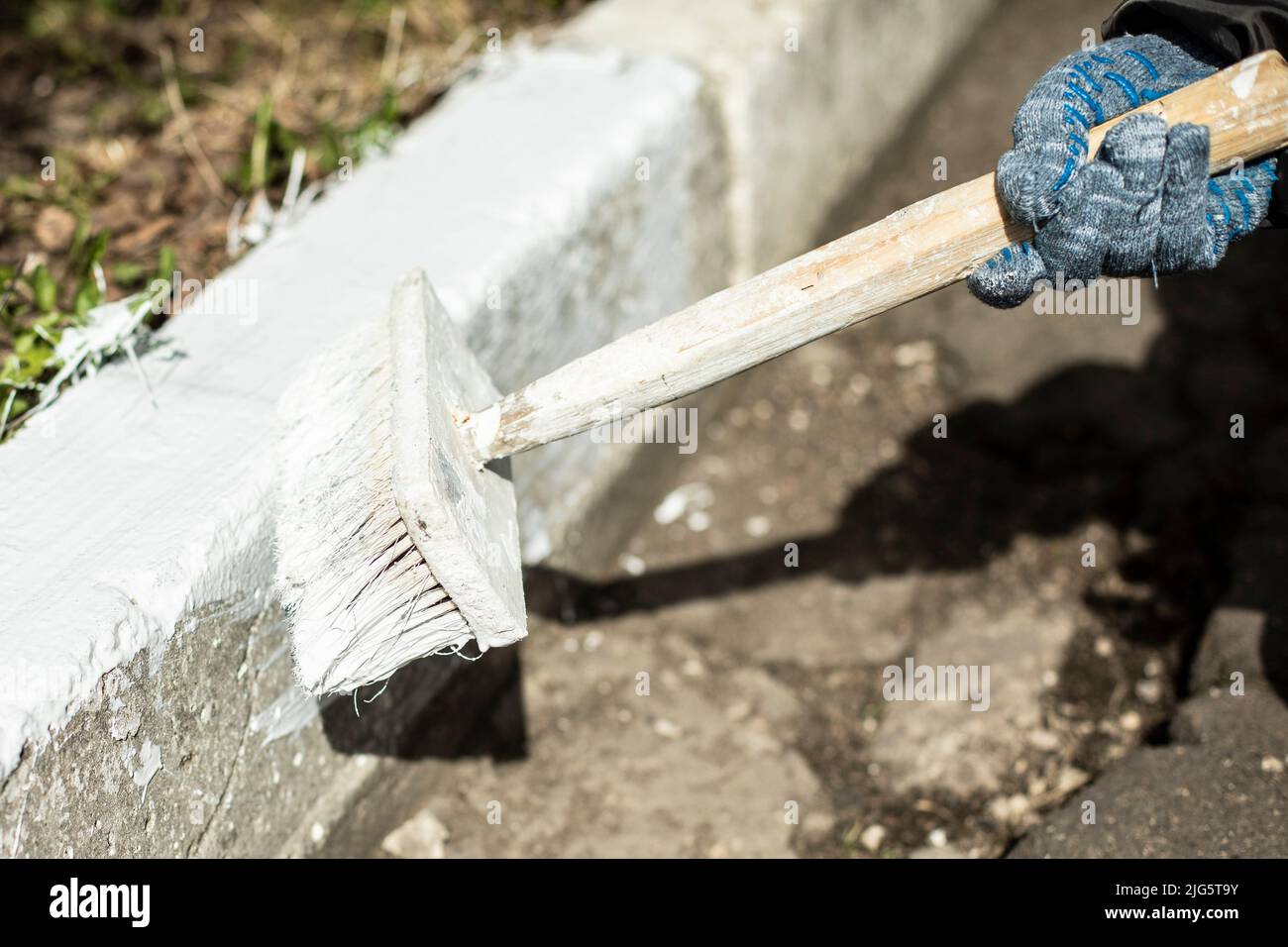 Painting road. Brush with white paint. Landscaping in city. Details of ...