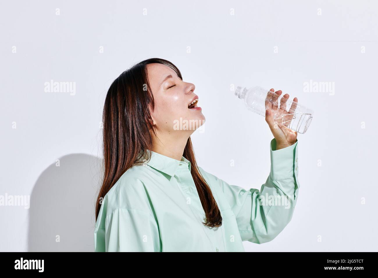 Japanese woman drinking water Stock Photo - Alamy
