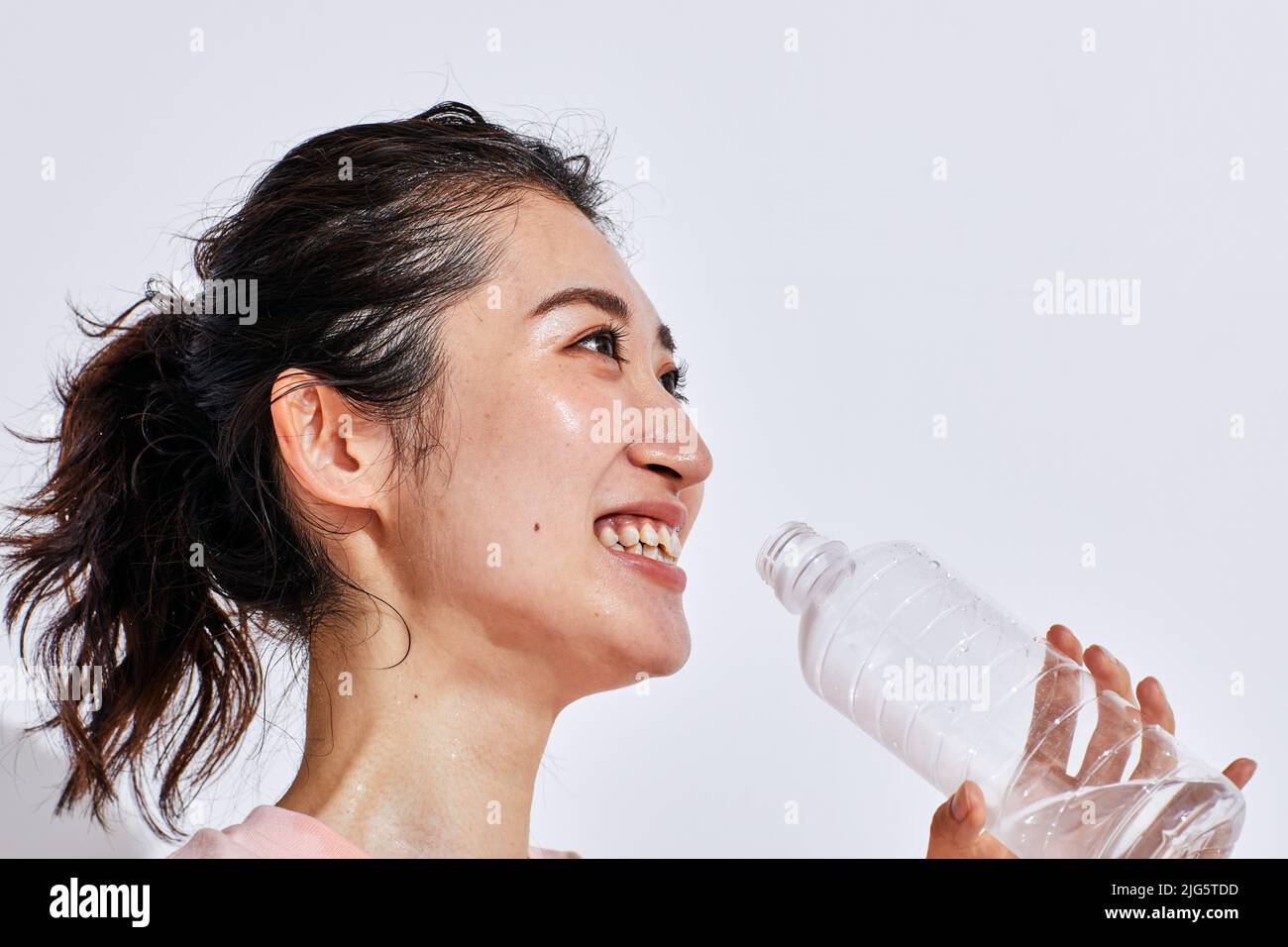 Japanese woman drinking water Stock Photo - Alamy