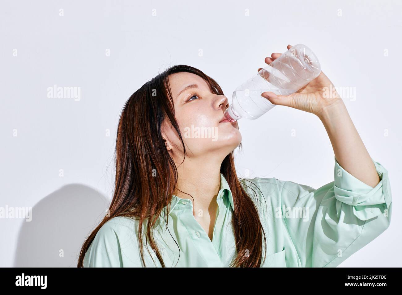 Japanese woman drinking water Stock Photo - Alamy