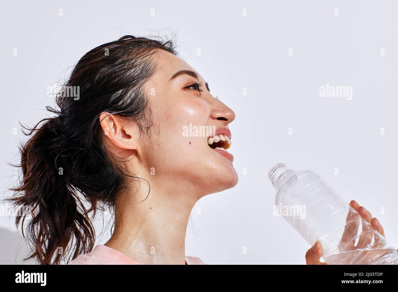 Japanese woman drinking water Stock Photo - Alamy