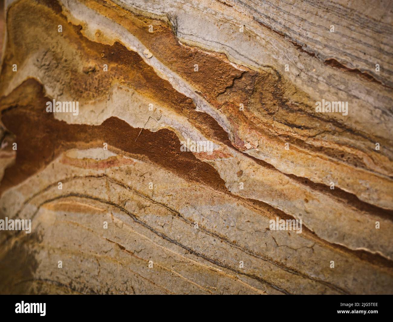 Stone wall with gradient layers of warm earthy tones Stock Photo - Alamy