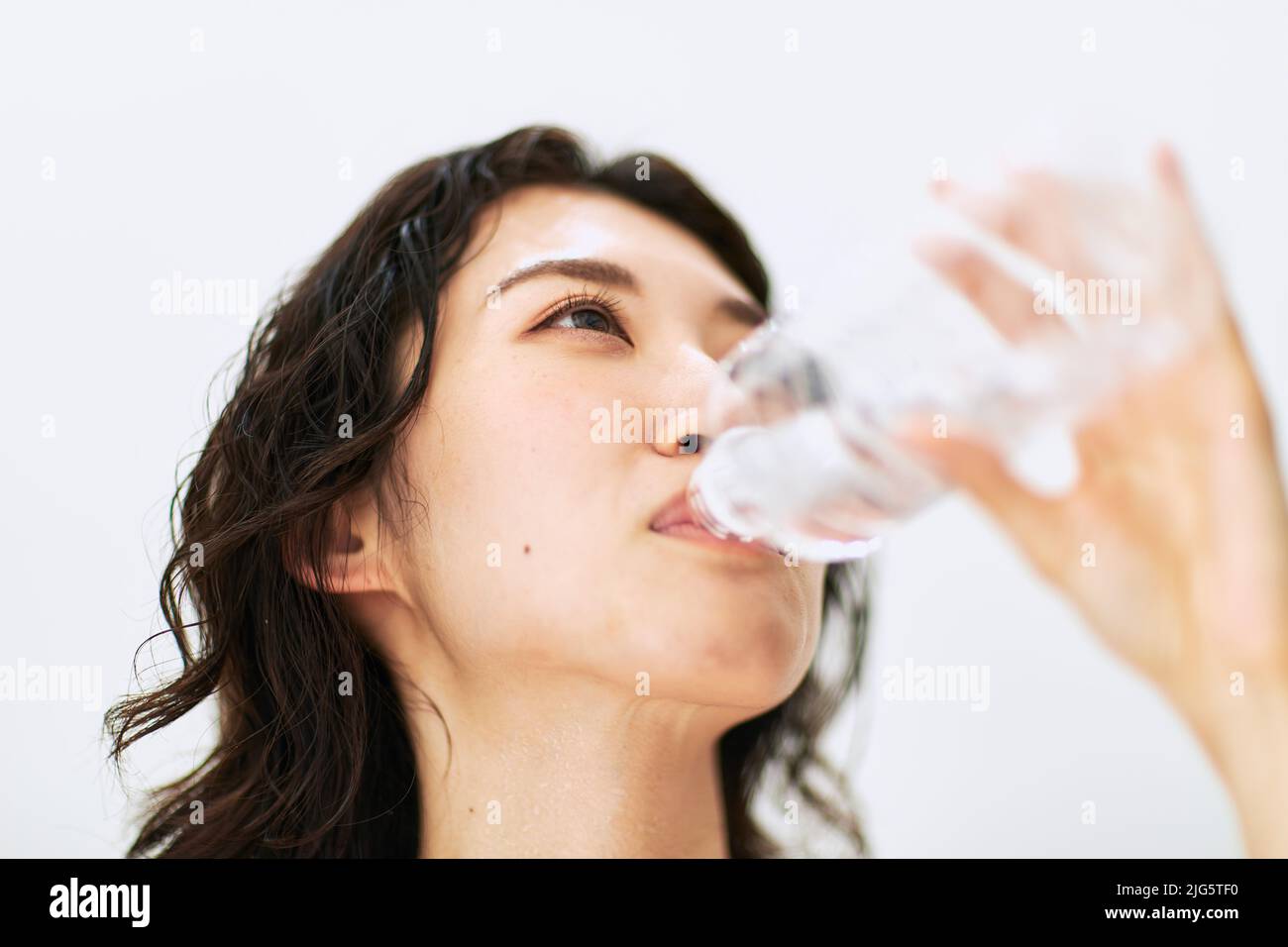 Japanese woman drinking water Stock Photo - Alamy