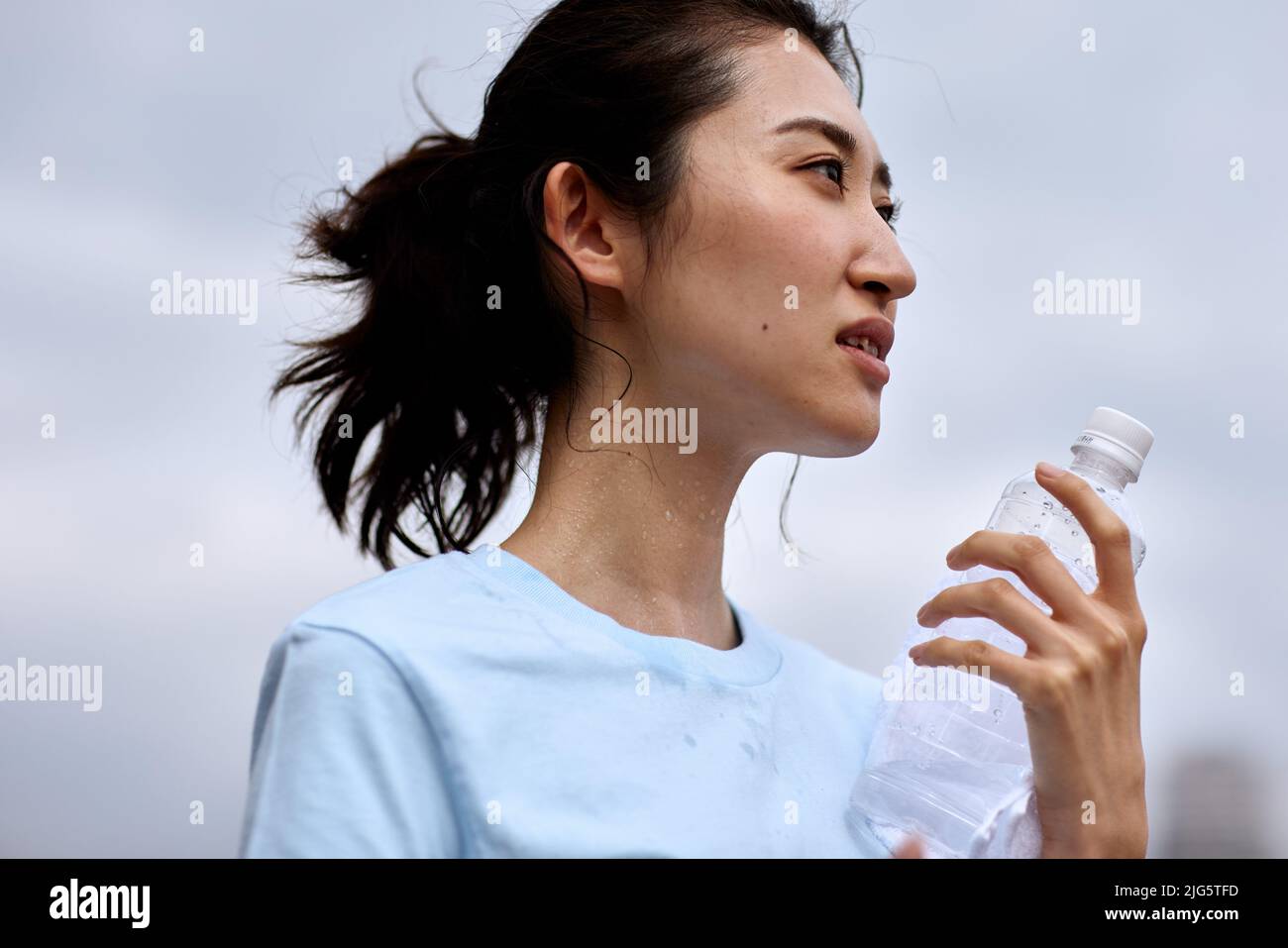 Japanese woman drinking water Stock Photo - Alamy