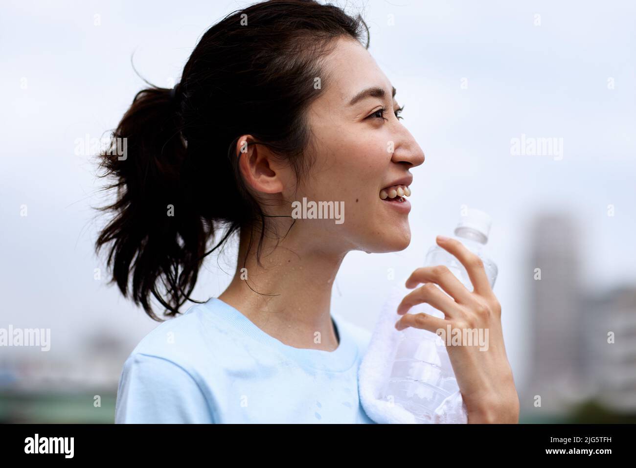 Japanese woman drinking water Stock Photo - Alamy