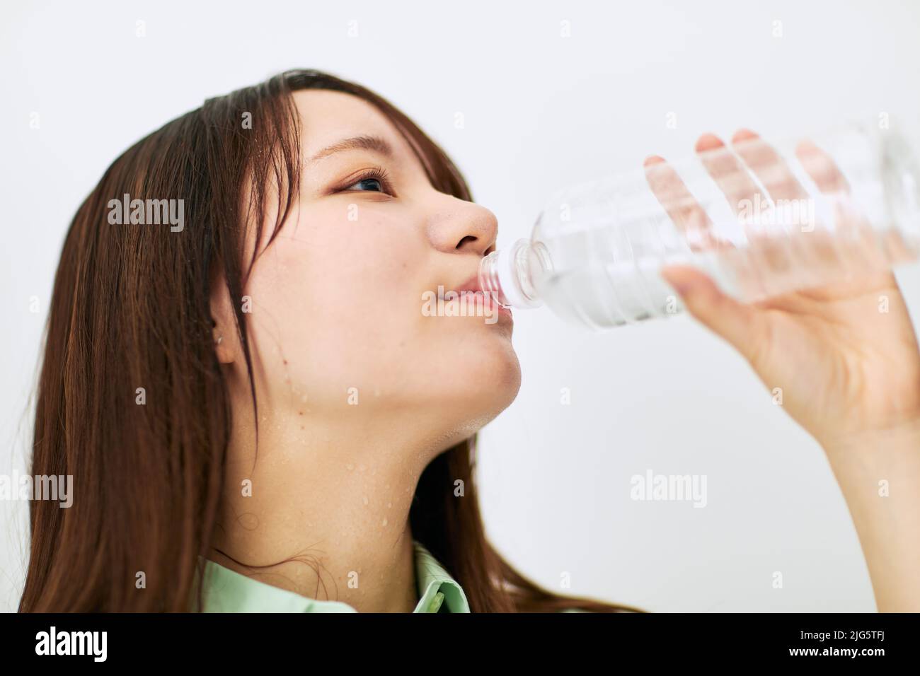 Japanese woman drinking water Stock Photo - Alamy