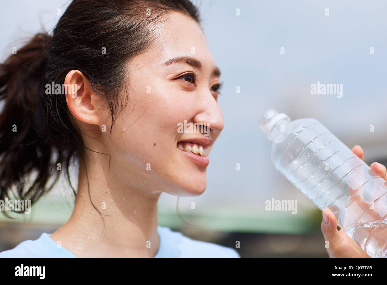 Japanese woman drinking water Stock Photo - Alamy