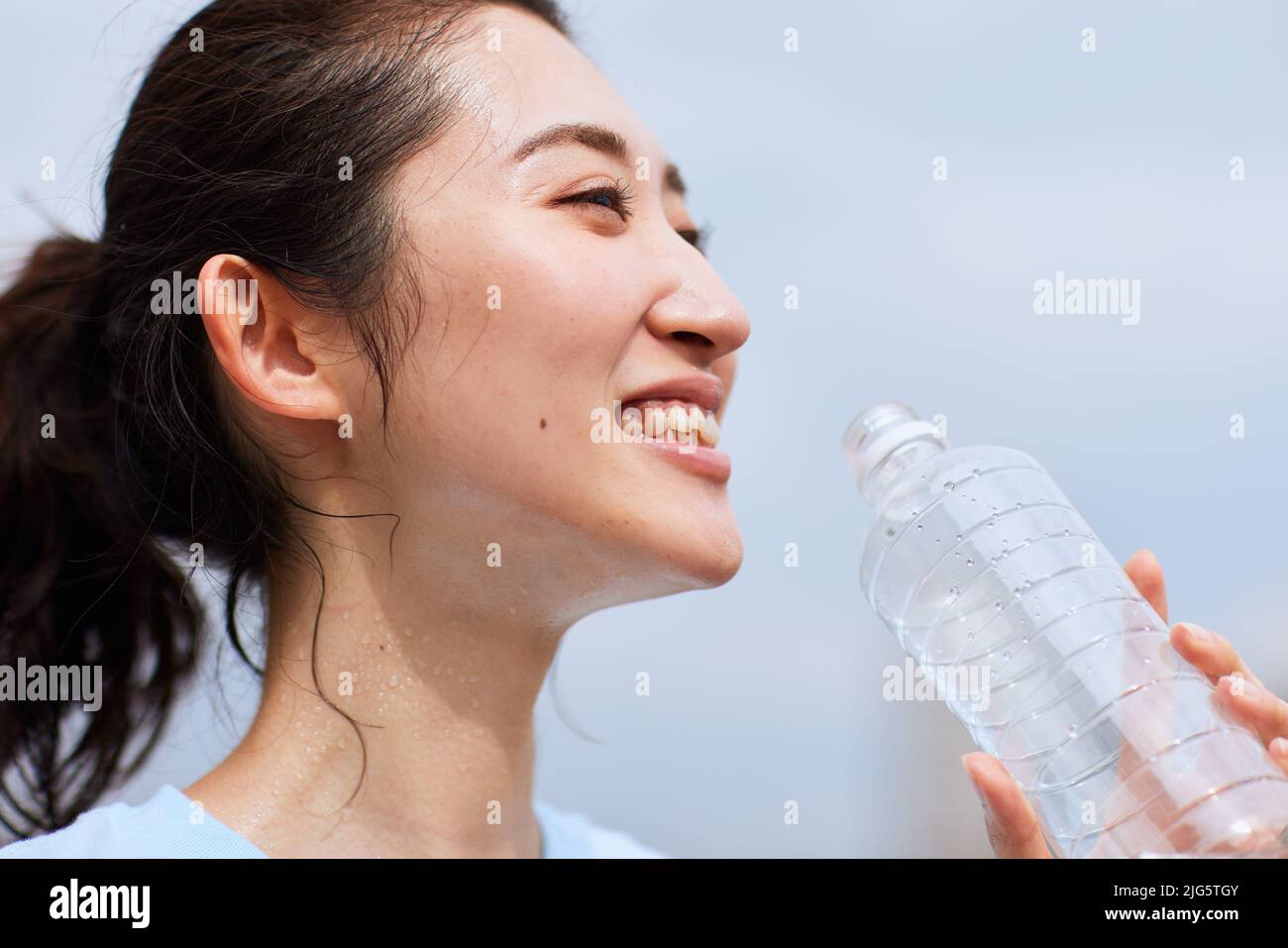Japanese woman drinking water Stock Photo - Alamy