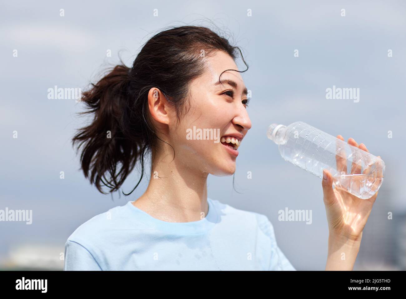 Japanese woman drinking water Stock Photo - Alamy