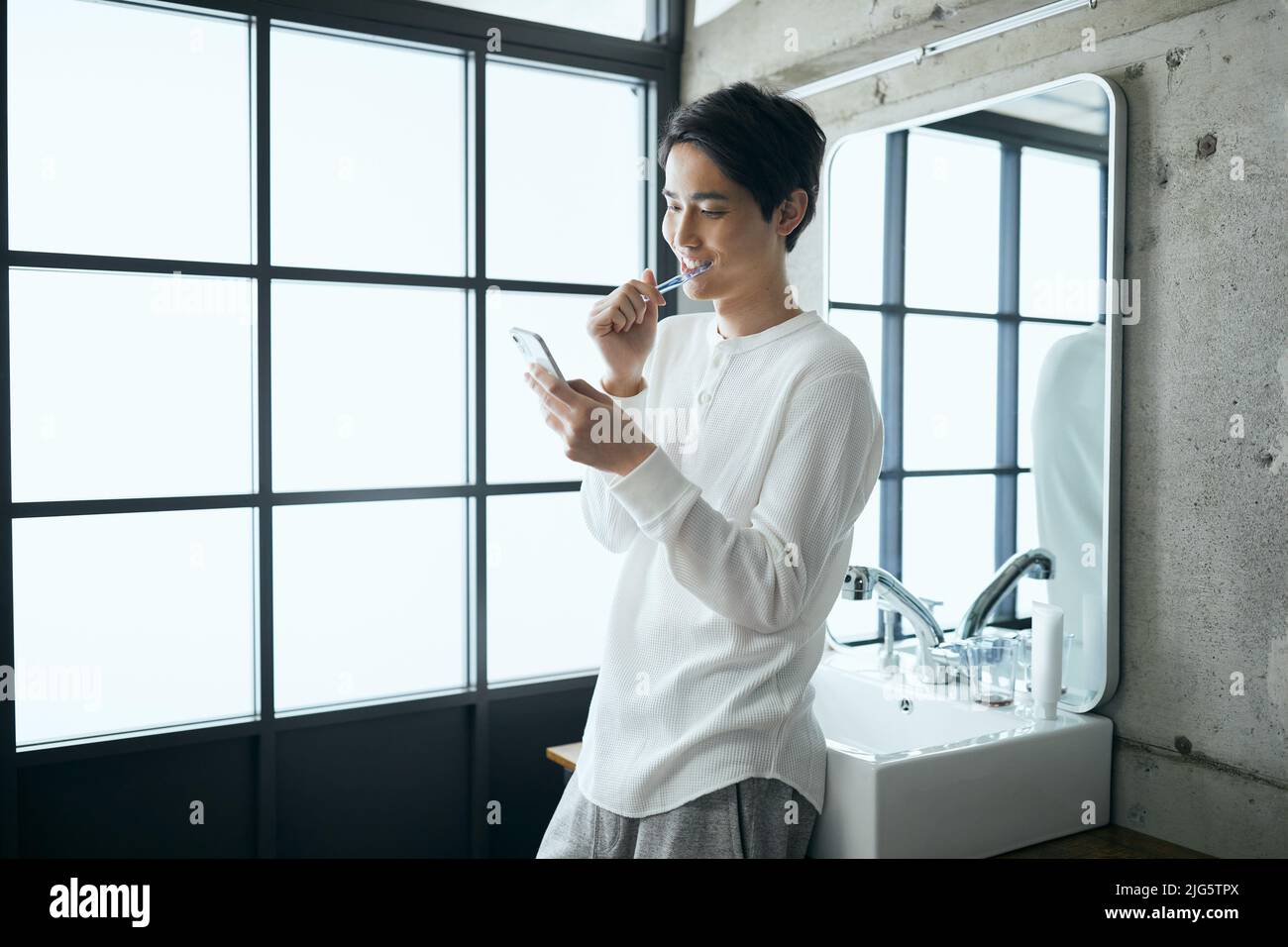 Japanese man brushing teeth Stock Photo - Alamy