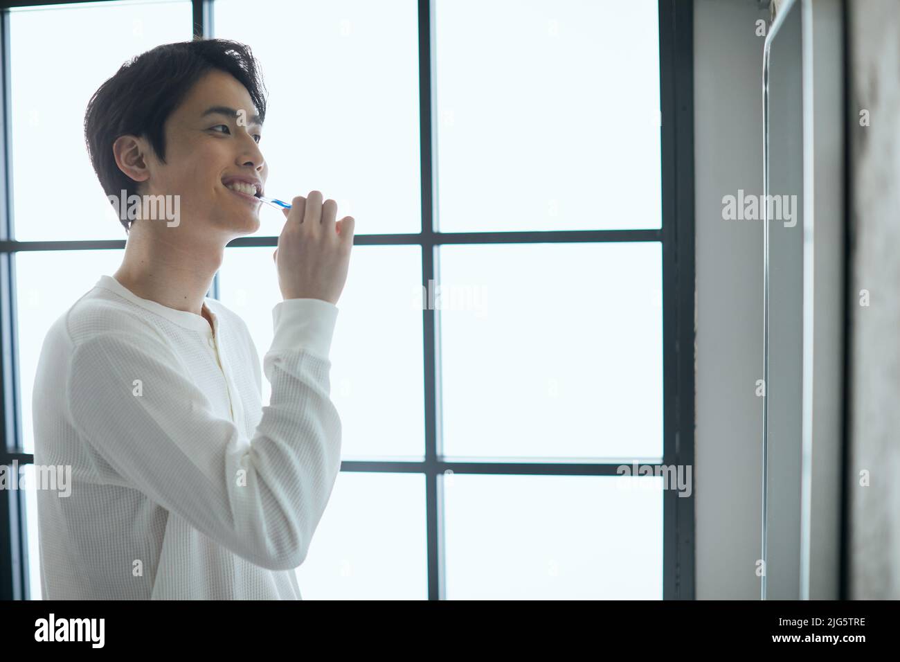 Japanese man brushing teeth Stock Photo - Alamy