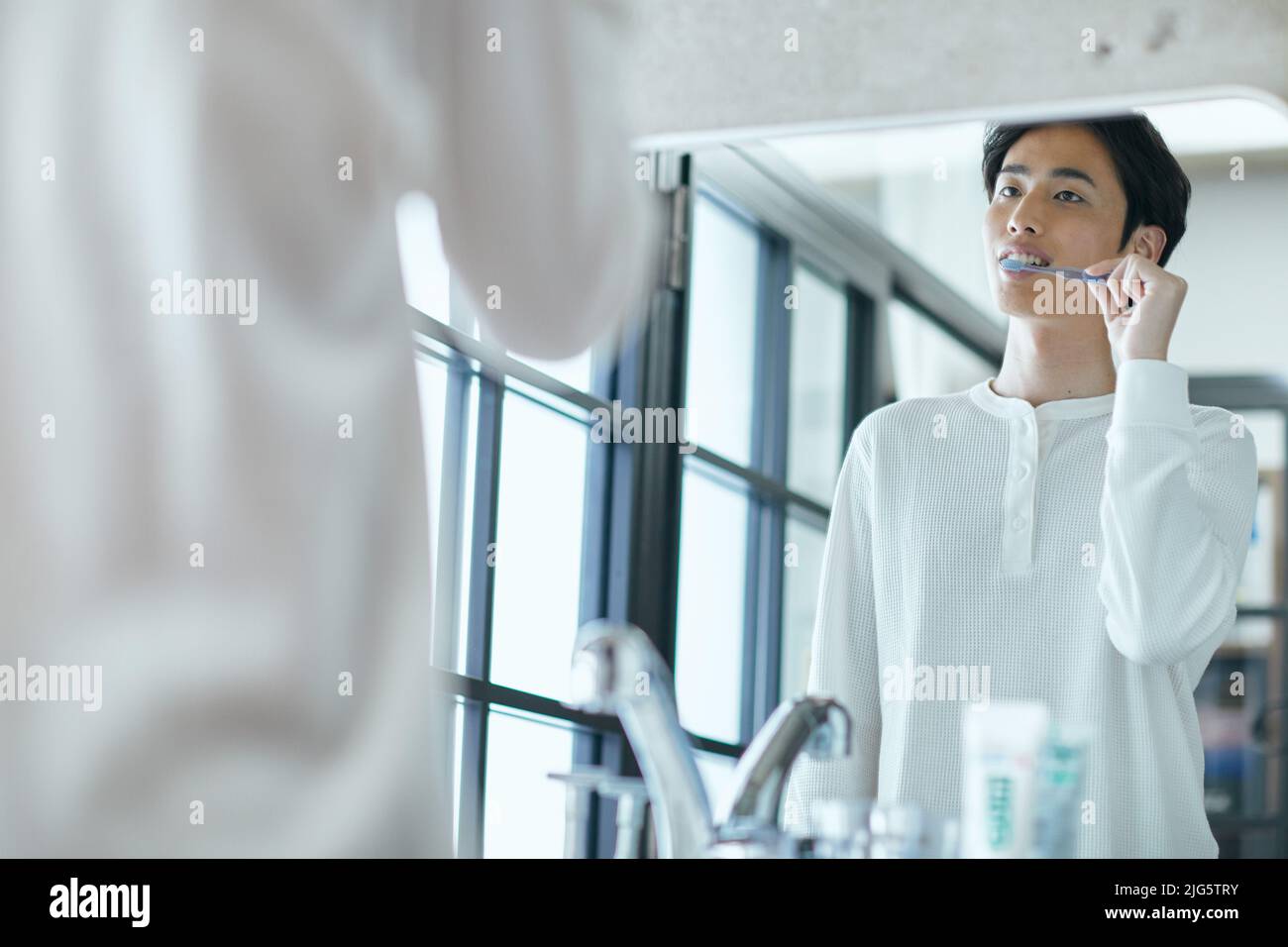 Japanese man brushing teeth Stock Photo - Alamy