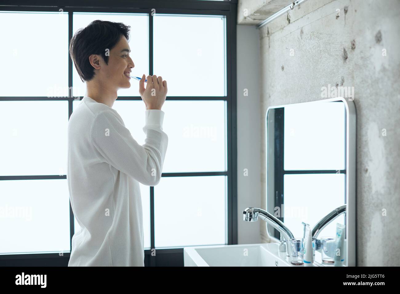 Japanese man brushing teeth Stock Photo - Alamy