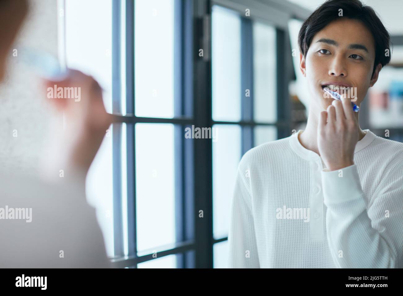Japanese man brushing teeth Stock Photo - Alamy