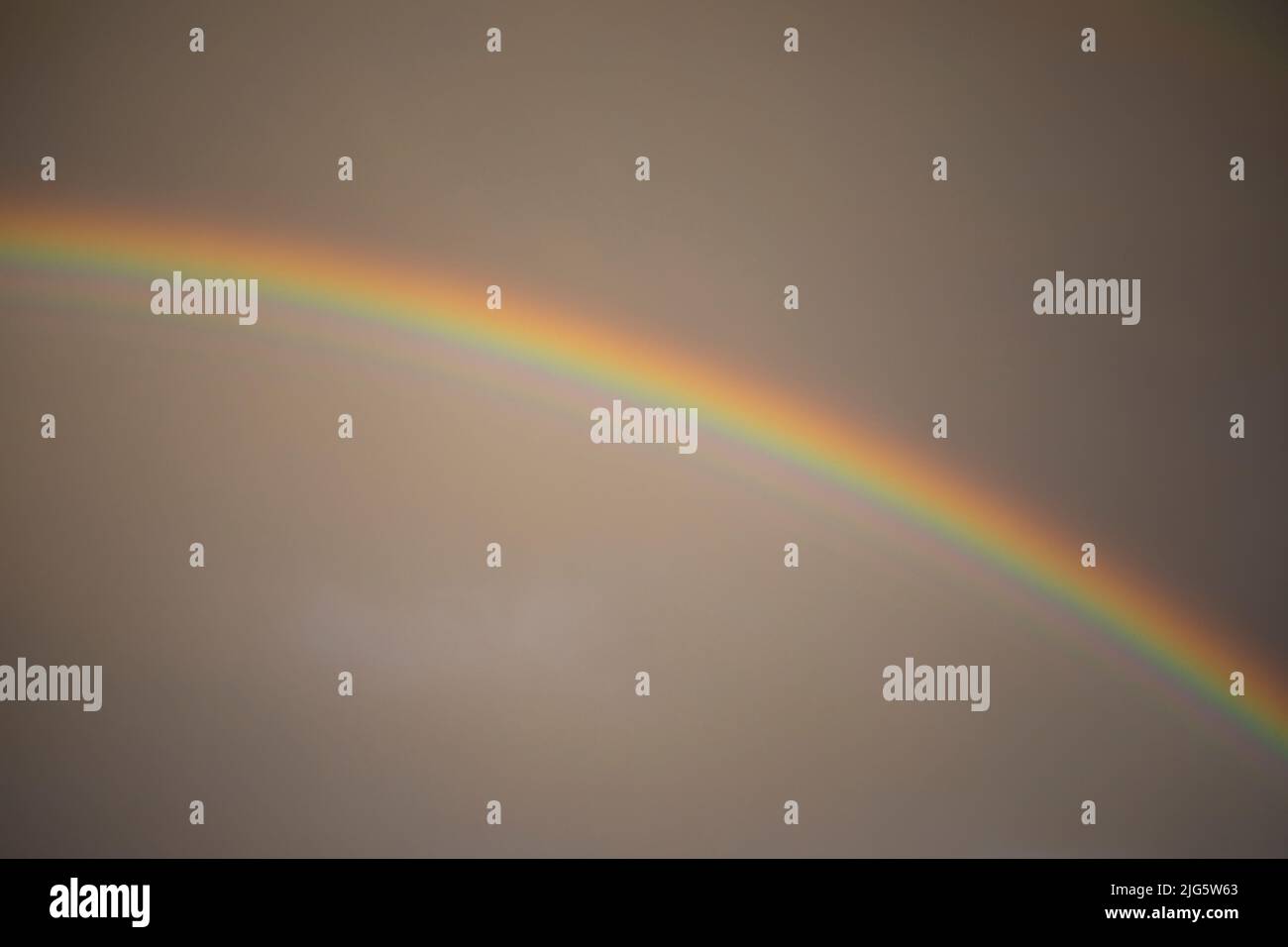 Rainbow in sky. Atmospheric phenomenon. Refraction of light. Celestial ...