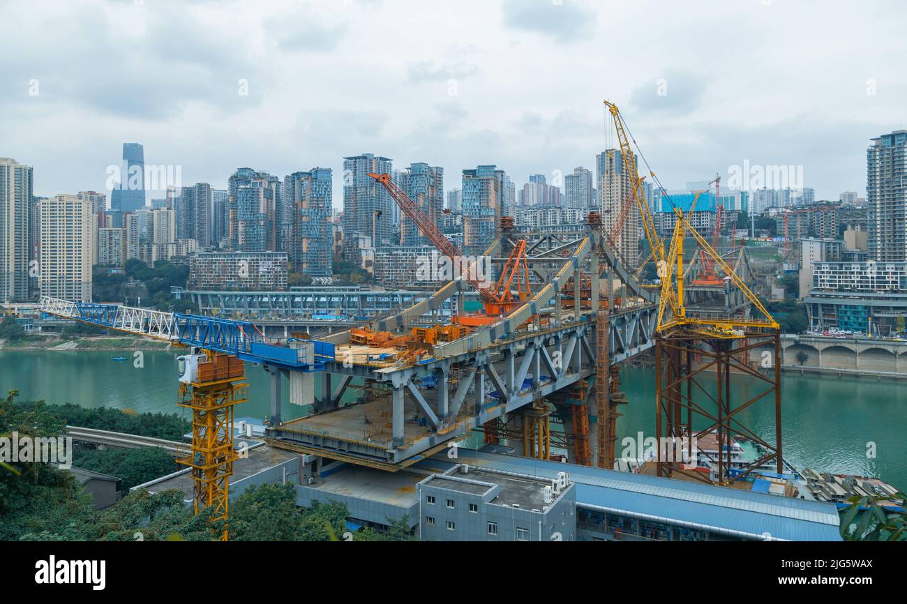 This is Chongqing, China, where a bridge is being built over a large ...