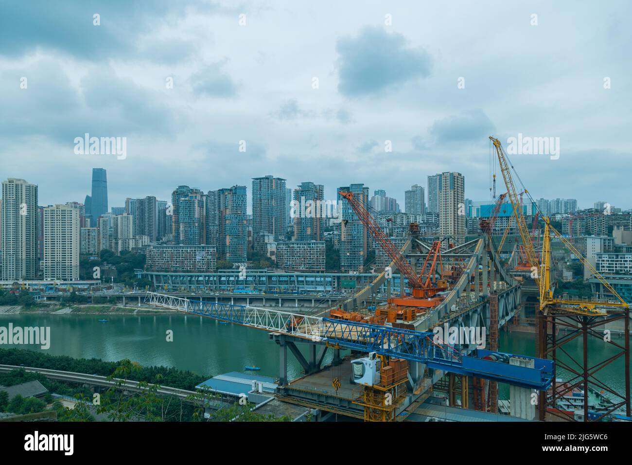This is Chongqing, China, where a bridge is being built over a large ...