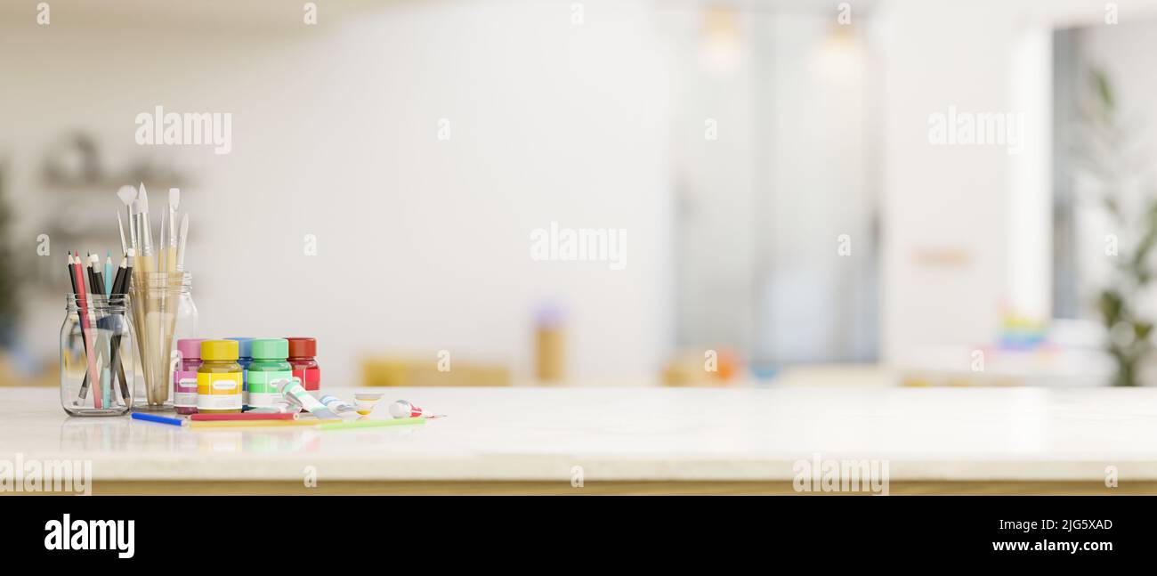 Modern tabletop workspace with painting tools, painting brushes ...