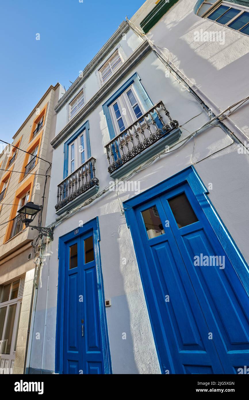 Classic architecture of vibrant buildings with blue doors in a city ...