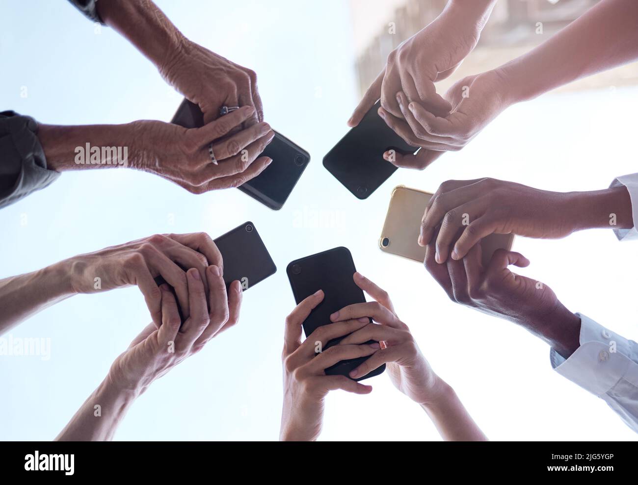 Were making money. Cropped shot of a group of unrecognizable ...