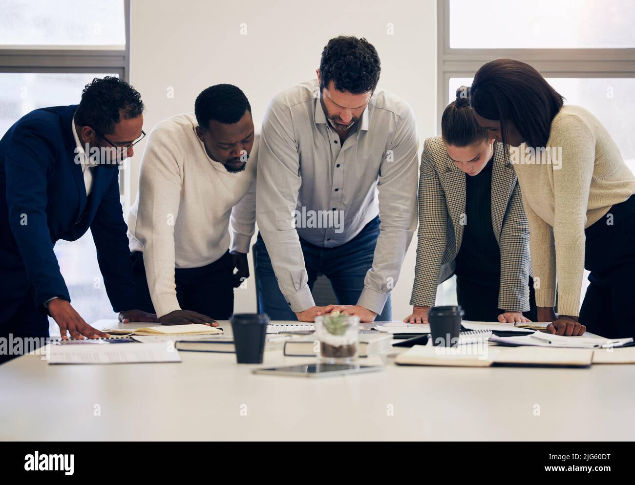 Deciding which of their ideas work best together. Shot of a group of ...