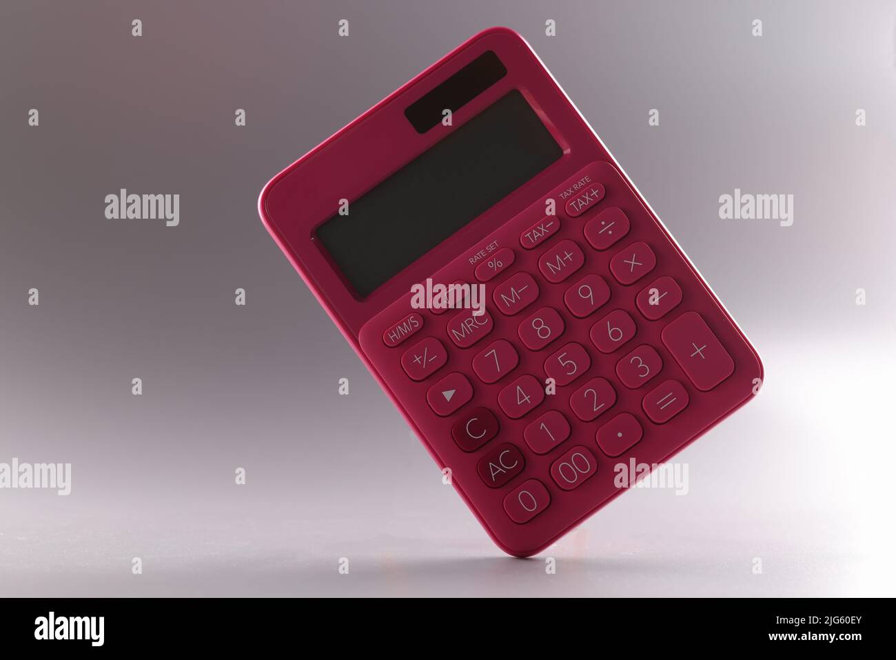 Pink calculator with numbers on gray background Stock Photo - Alamy