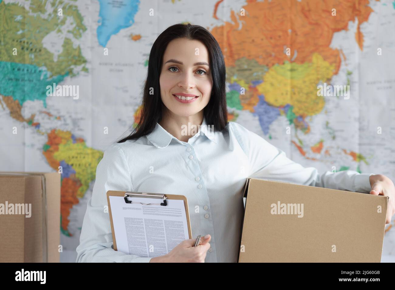 Happy female employee holding cardboard hi-res stock photography and images - Alamy