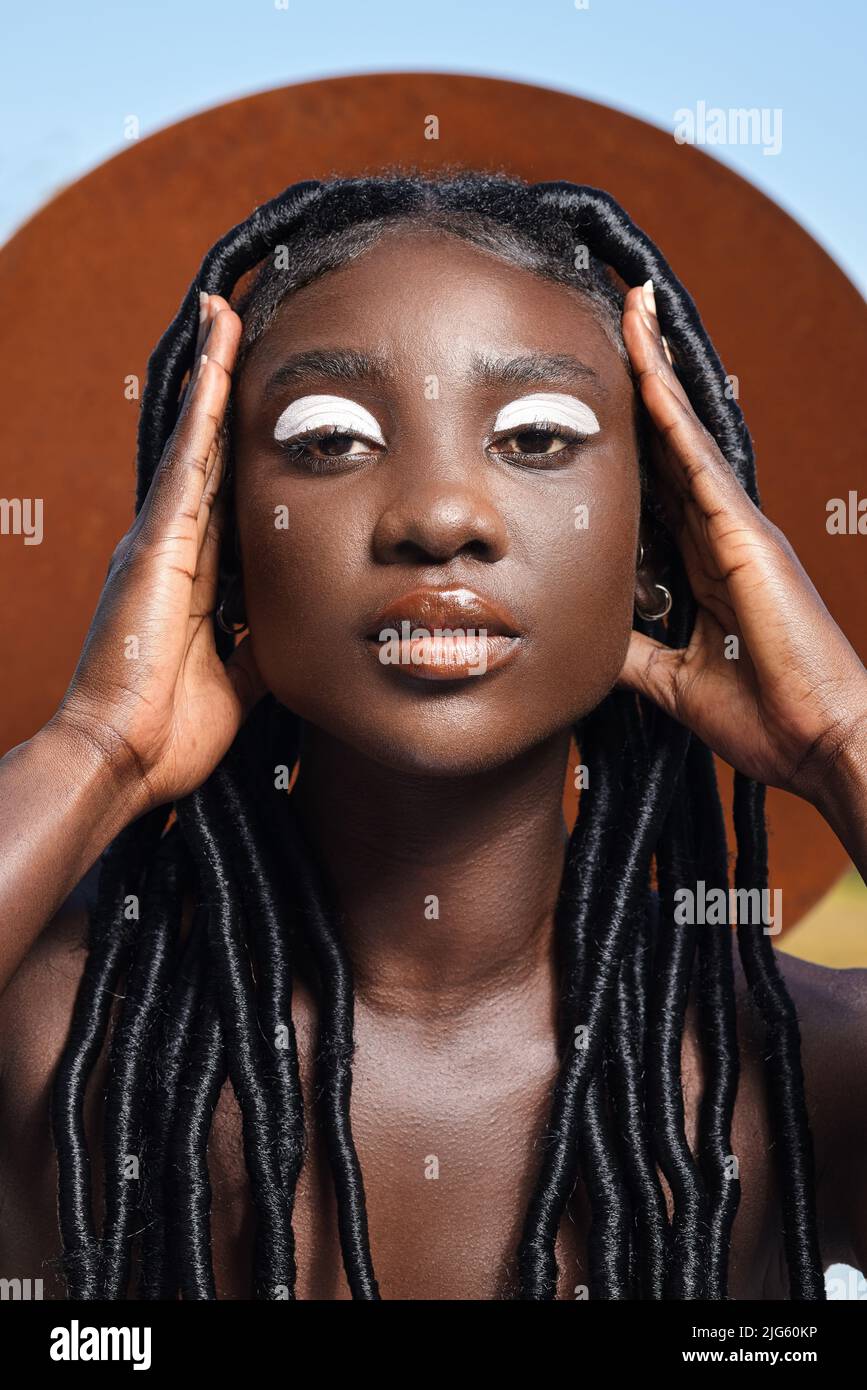 Rocking that traditional look. Cropped portrait of an attractive young ...
