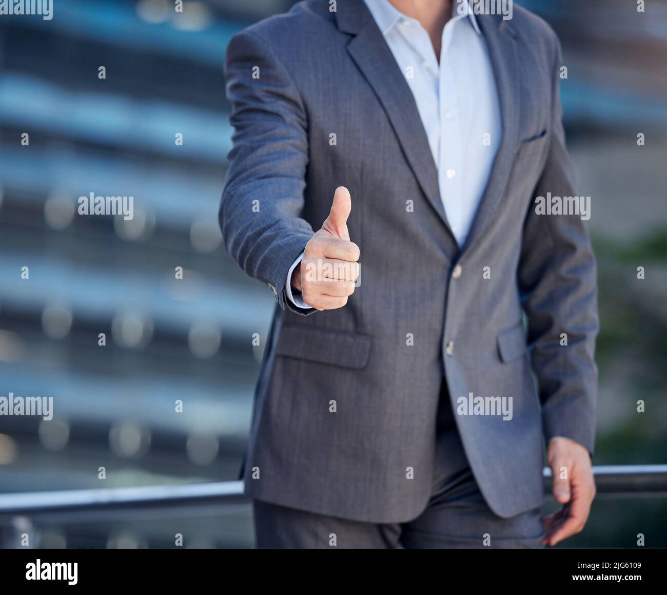 Everythings great. Shot of an unrecognizable businessman showing a ...