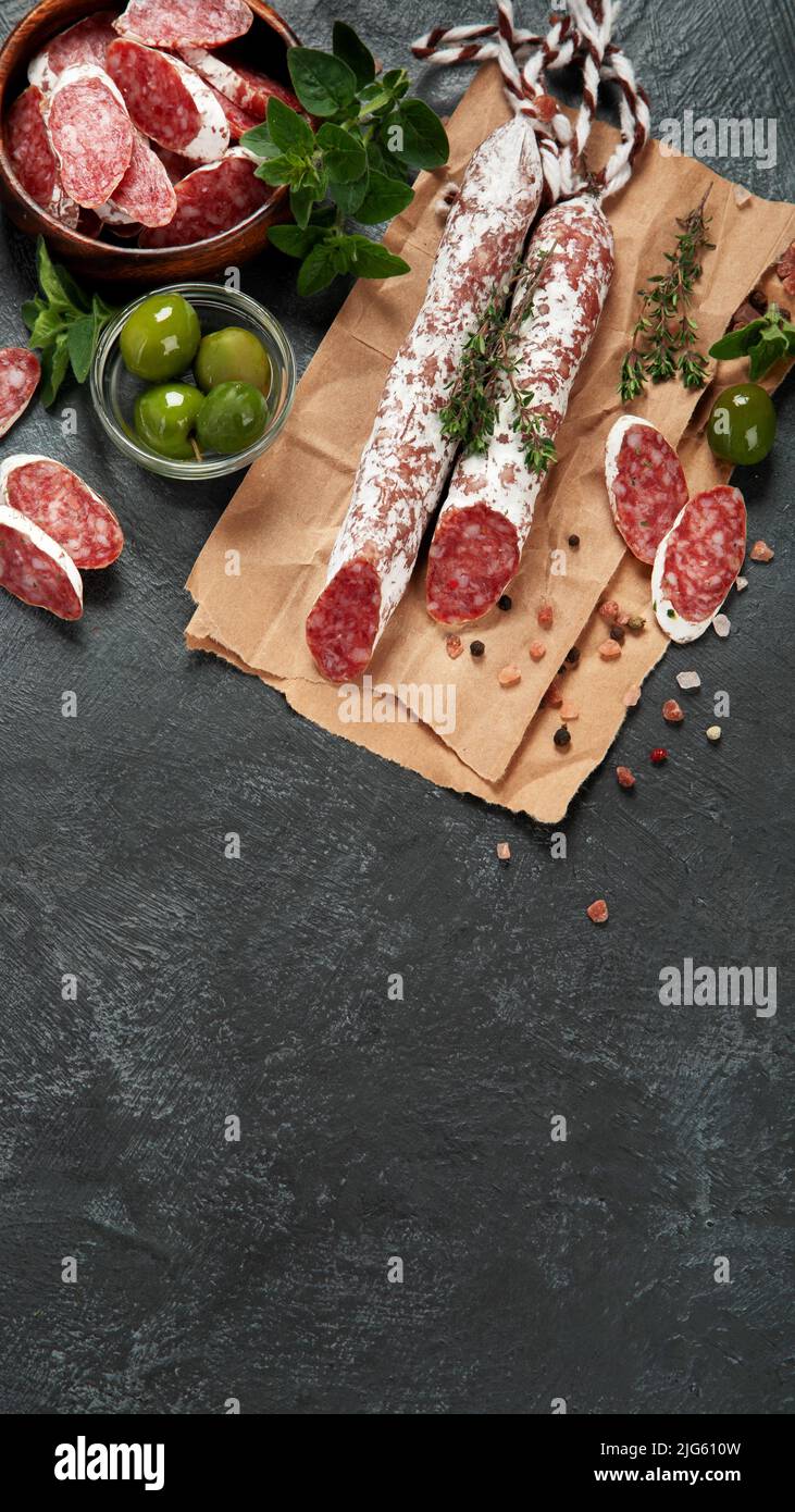 Traditional Spanish fuet on gray background. Dry cured pork sausages ...