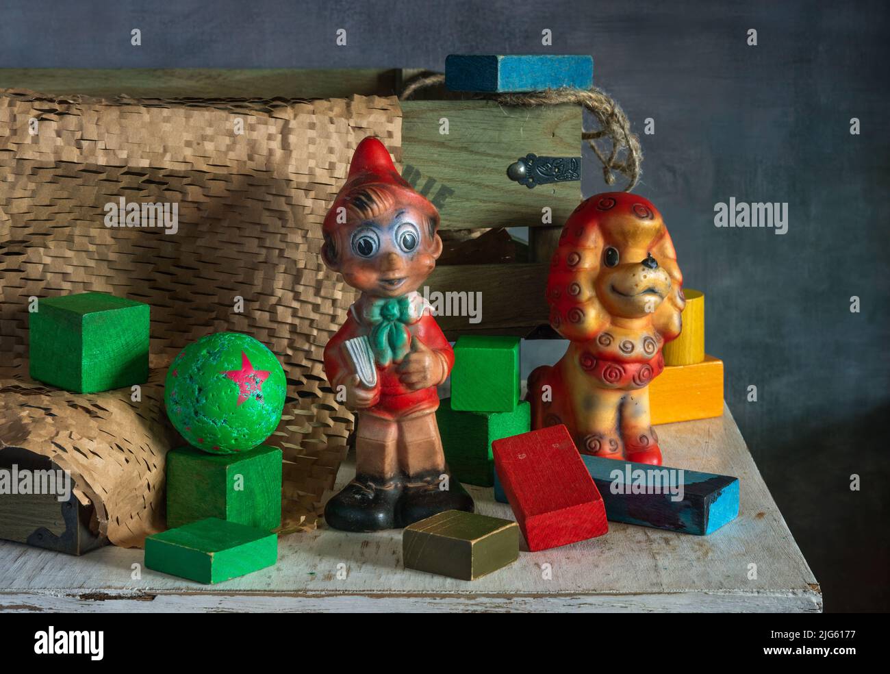 Still life with old rubber dolls and wooden cubes. Toys. Vintage Stock ...