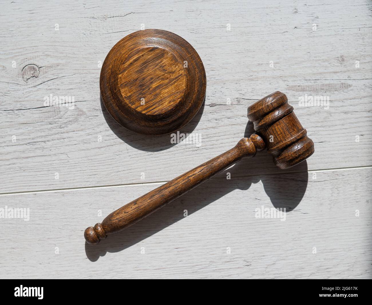 Wooden judicial gavel on a wooden laminate Stock Photo - Alamy