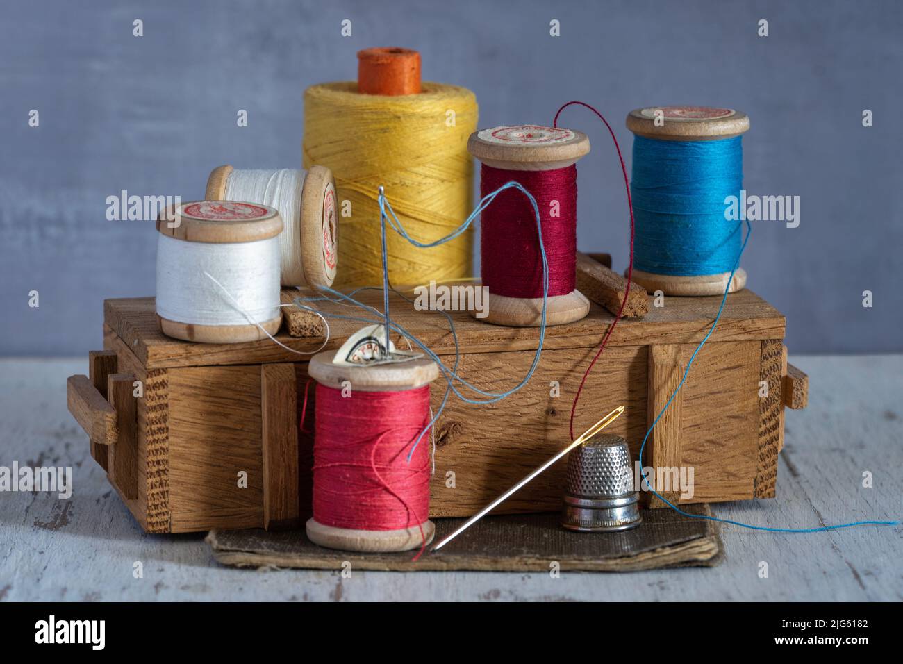 Still life with sewing accessories and a box. Vintage Stock Photo - Alamy