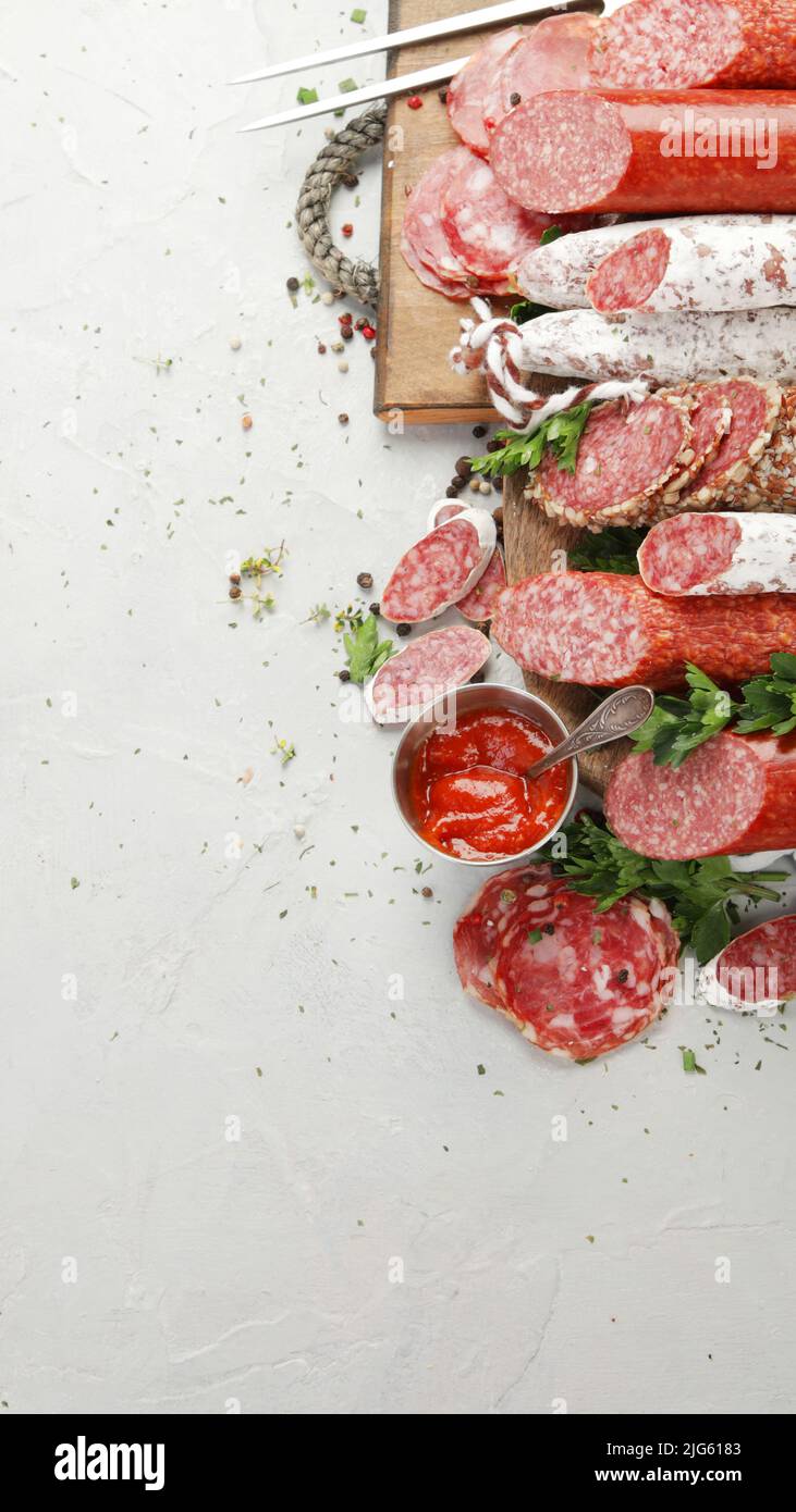 Sausages salami assortment on light background. Meat product made of ...