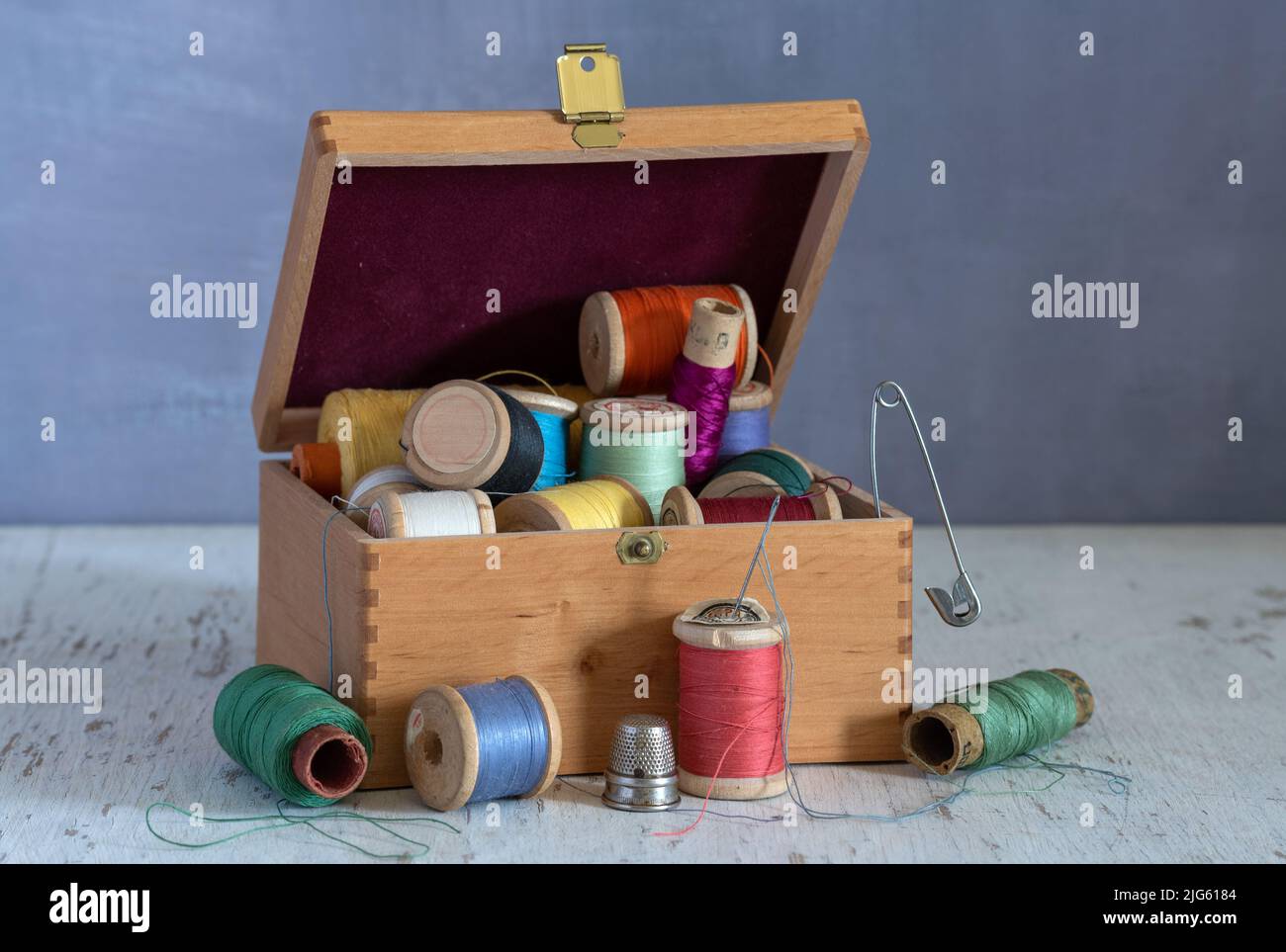 Still life with sewing accessories and a box. Vintage Stock Photo - Alamy